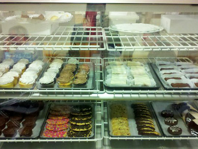 The dessert case&mdash;where willpower goes to die and "I'll just have a bite" becomes the day's most optimistic fiction.