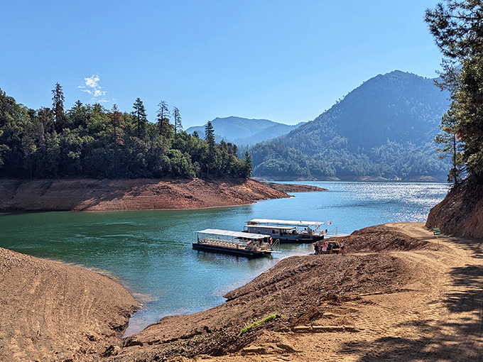 The approach to adventure looks like this: turquoise waters, waiting boats, and the promise of geological marvels hidden within the mountainside.