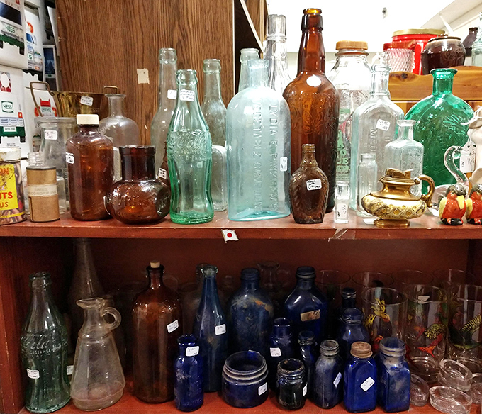 Bottle collectors' nirvana! These vintage glass vessels in cobalt blue, amber, and aqua capture light and history in equal measure.