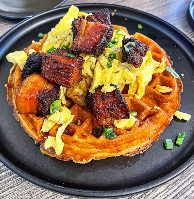 The waffle that said, "Hold my syrup" and invited burnt ends to the party. Those scallions aren't just garnish&mdash;they're tiny green flags signaling victory.