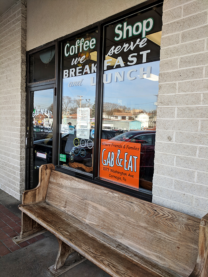 This weathered bench has witnessed countless conversations, morning greetings, and the anticipation of hungry patrons about to discover their new favorite breakfast spot.