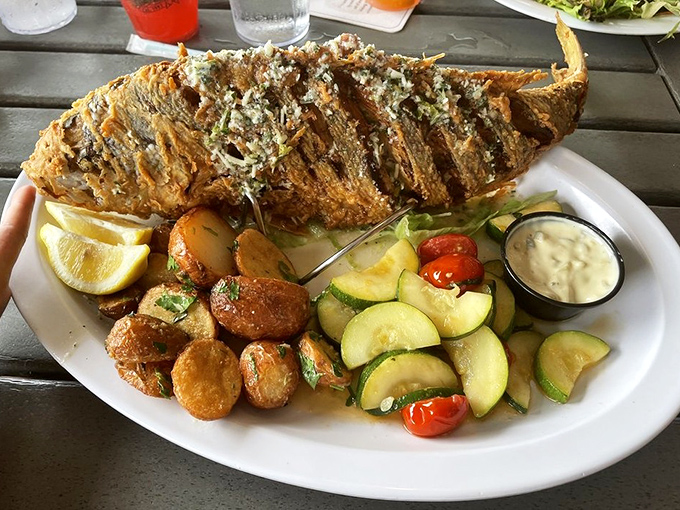 When they say "whole fried fish," they're not kidding &ndash; this yellow tail arrived ready for its glamour shot.