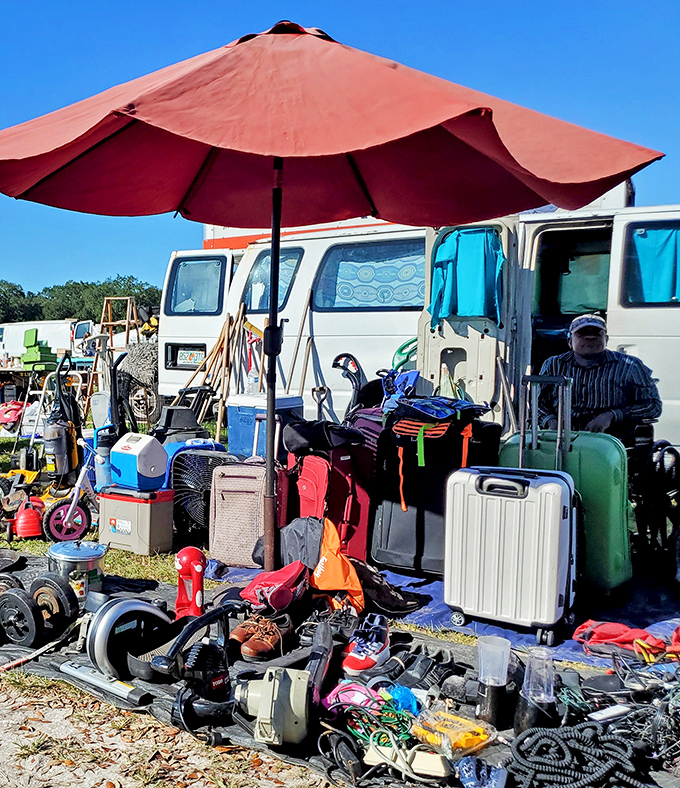 The ultimate "one man's trash" philosophy in action. Under that red umbrella lies someone's future heirloom, just waiting to be discovered.