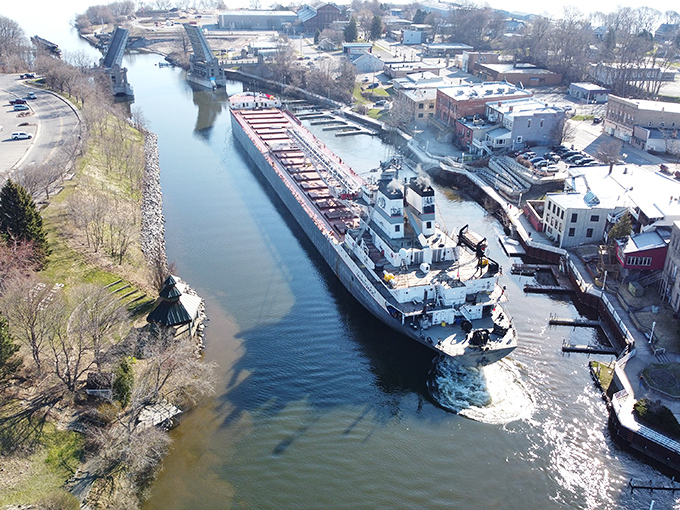 Aerial views reveal Manistee's perfect blend of water, history, and affordability spread like a welcoming buffet.