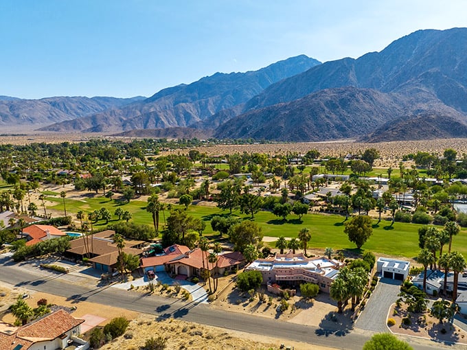 An aerial view reveals Desert Hot Springs' perfect balance &ndash; green golf courses and palm-lined streets surrounded by the raw beauty of desert wilderness.