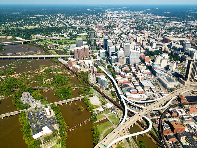 Richmond unfolds from above like a perfect urban diorama, with the James River snaking through downtown as nature's dividing line between historic and happening.