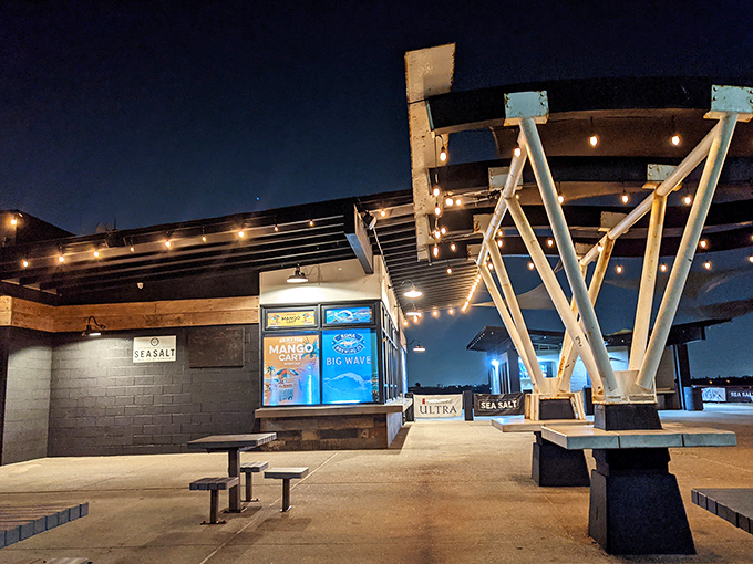 As night falls, Sea Salt's architectural elements take center stage. The illuminated structure becomes a lighthouse for the hungry, guiding them to burger salvation.