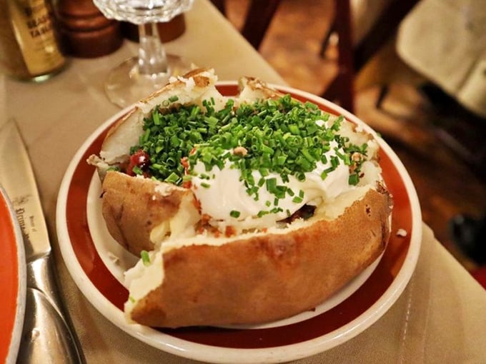 A baked potato dressed for a night on the town with sour cream, chives, and a sense of purpose. Comfort food wearing its Sunday best.