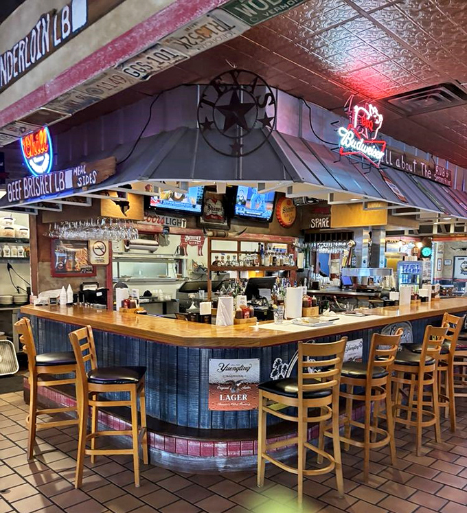 The bar area—where craft beers flow and barbecue stories grow. Those bar stools have witnessed countless "best meal of my life" declarations.