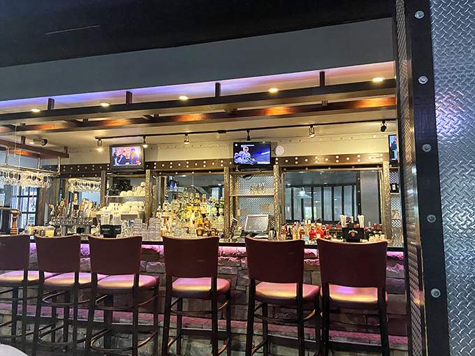 The bar isn't just serving drinks; it's a gleaming command center for liquid happiness, bathed in the kind of lighting that makes everyone look famous.