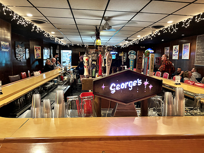 The bar at George's glows with vintage charm &ndash; where strangers become friends and friends become regulars over cold beers and hot burgers.