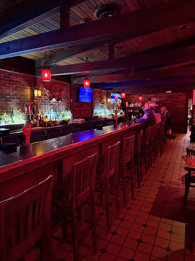 The bar at Redcoat Tavern: where strangers become friends and friends become regulars. That warm glow isn't just lighting&mdash;it's ambiance with purpose.