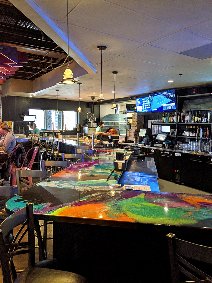 The bar's colorful epoxy countertop looks like abstract art you can rest your elbows on while contemplating your next delicious life decision.