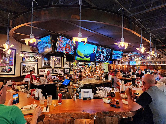 The beating heart of The Pour House&mdash;where bartenders orchestrate liquid happiness and TVs ensure you never miss a game-changing play.