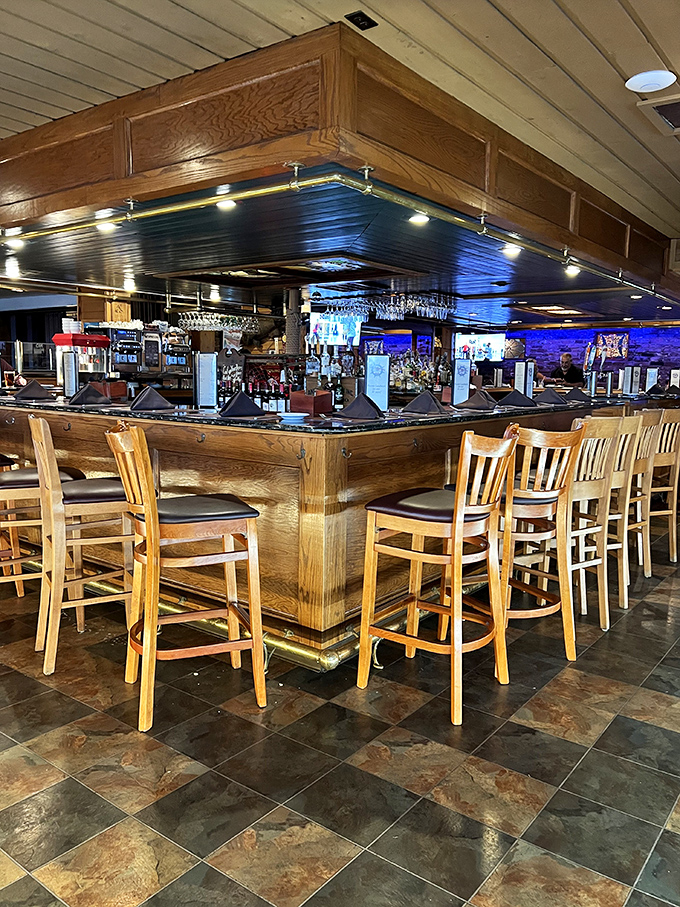 The bar at Smuggler's Cove—where seafood stories get better with each retelling. Wood, brass, and the promise of a good time.