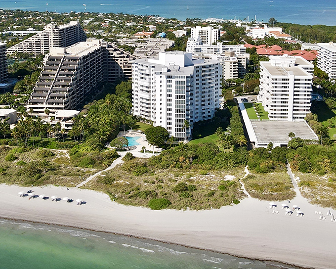 Beachfront condos rise like modern sentinels guarding access to some of Florida's most coveted sand, where the Atlantic meets architectural ambition.
