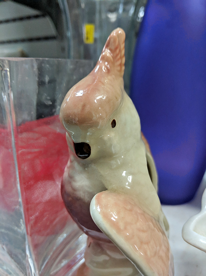 Vintage ceramic bird figurine that somehow manages to be simultaneously hideous and completely irresistible&mdash;the essence of thrift store magic.