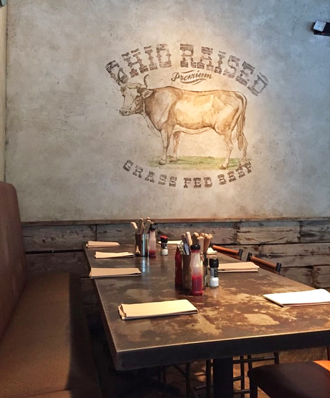 Comfortable booth seating invites lingering conversations over exceptional food that demands proper appreciation time.