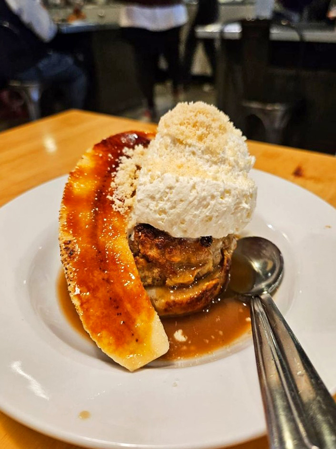 This bread pudding with caramelized banana and ice cream doesn't just end your meal—it creates a memory that will haunt your dessert dreams.