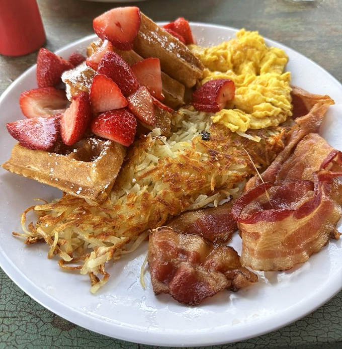 The breakfast platter that answers the eternal question: "Why choose one thing when you can have everything?" Waffle, eggs, bacon, and no regrets.
