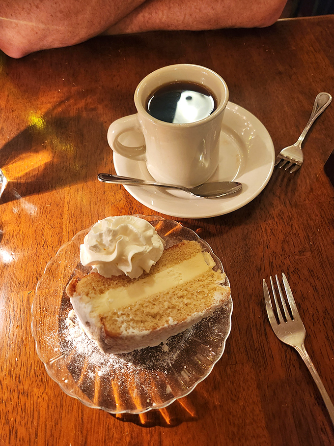 Coffee and cake&mdash;civilization's greatest achievement. That slice isn't dessert, it's the period at the end of a delicious sentence.