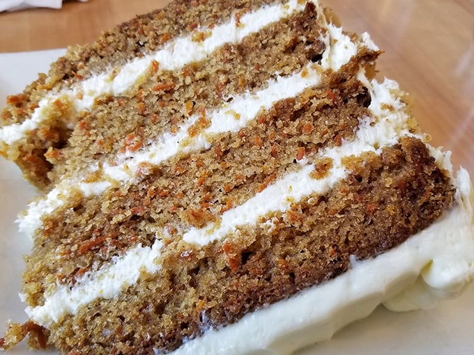 Carrot cake that doesn't skimp on the frosting. Each layer tells a story of someone who understands the importance of proper cake-to-frosting ratio.