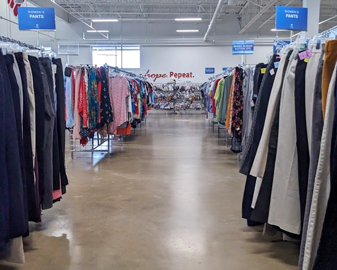 The pants section stretches into infinity, a denim-lined corridor where $7 can transform your wardrobe and possibly your outlook on life. 