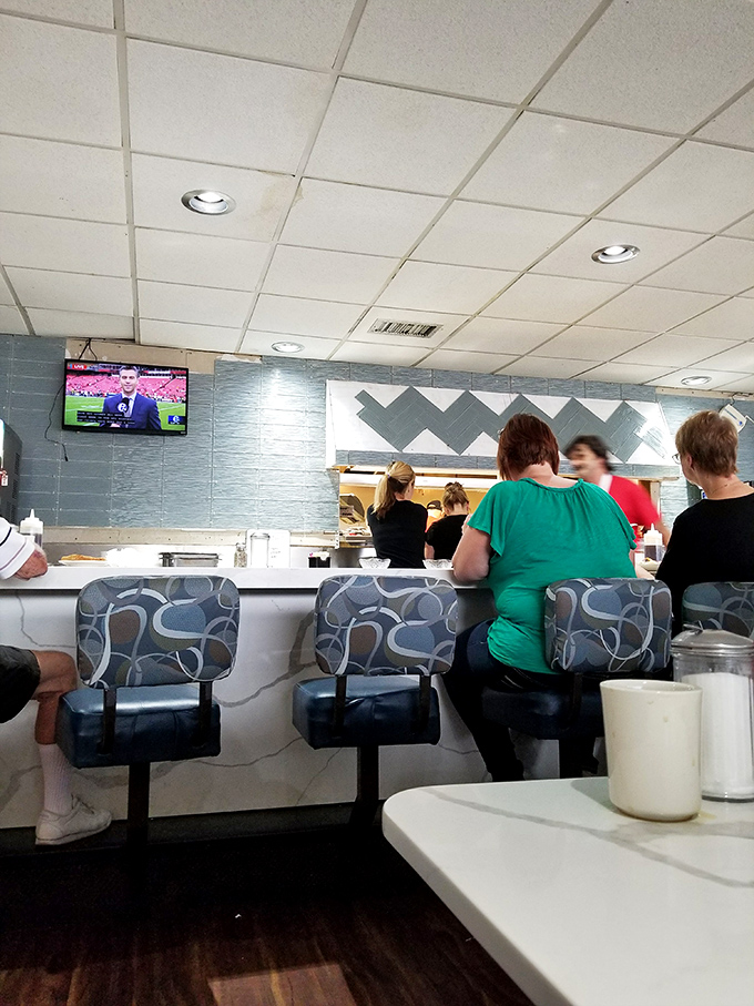 The counter seating—where solo diners become temporary family, united by coffee refills and the shared language of good food.