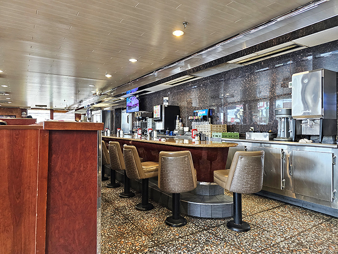 Counter seating: where solo diners become regulars and servers become therapists. The best conversations happen while waiting for your coffee refill.