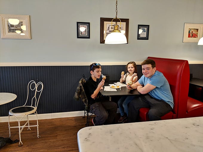 Three generations enjoying ice cream together proves that while fashion and technology change, the look of pure dessert joy remains exactly the same through the decades.