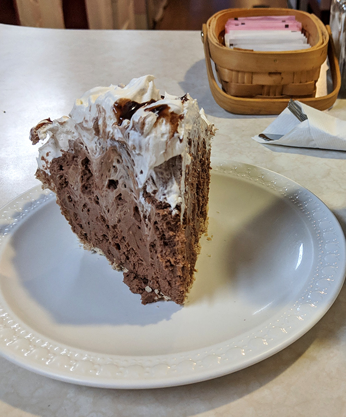 Chocolate pie that makes grown adults consider licking the plate. The whipped cream isn't decoration&mdash;it's the cloud you'll float away on.