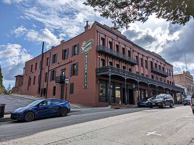The National Hotel stands as a brick testament to Gold Rush prosperity, its wrought-iron balconies still watching over Broad Street's comings and goings.