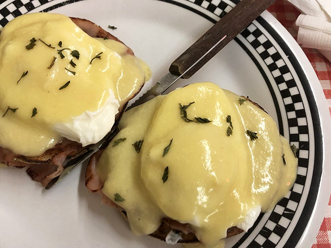 Eggs Benedict: poached eggs wearing hollandaise jackets atop ham islands. Breakfast doesn't get more elegant than this diner masterpiece.