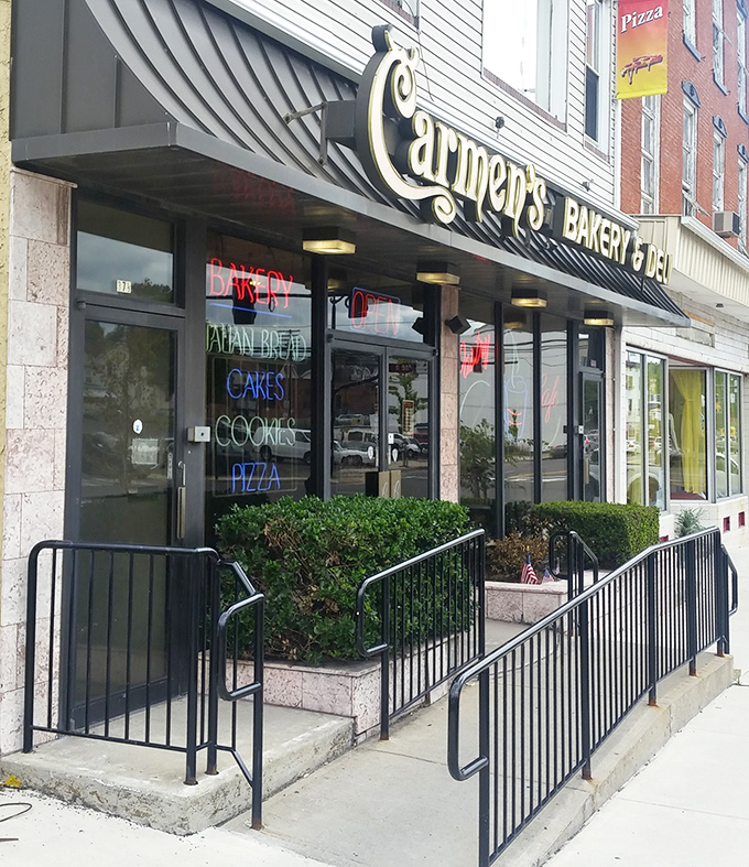 The entrance to epicurean enlightenment. Carmen's welcoming fa&ccedil;ade and colorful window signs invite hungry passersby to discover Pennsylvania's hoagie headquarters.