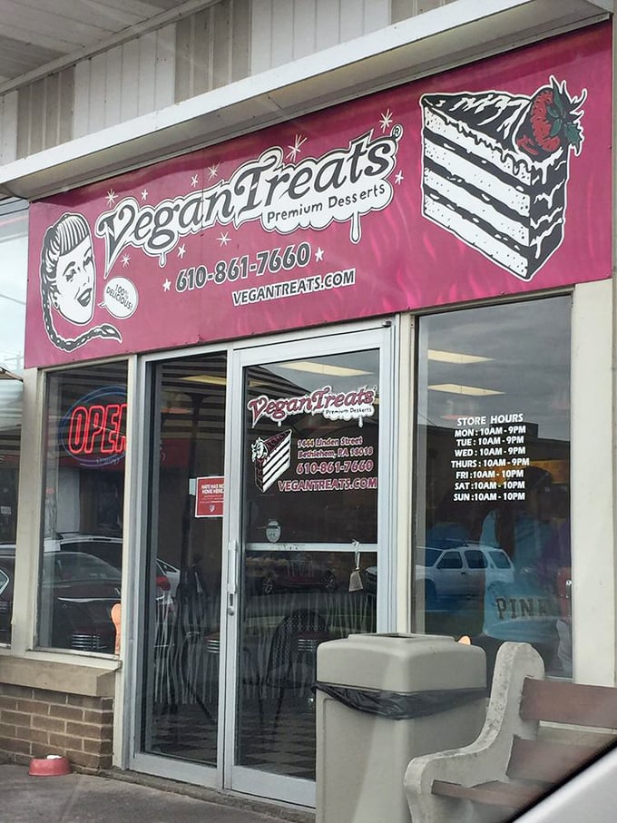 The welcoming entrance with its iconic pink signage. Those store hours are worth noting for your inevitable return visits.