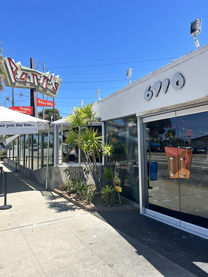 That entrance, with its distinctive address and vintage sign, has welcomed hungry Angelenos through its doors since Eisenhower was president.