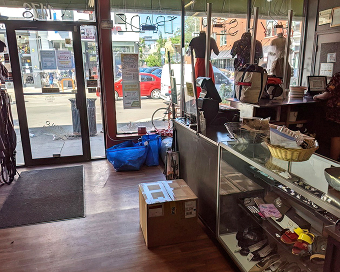The entrance offers a glimpse of Milwaukee Avenue through glass doors, reminding shoppers of the world outside this fashion time capsule.