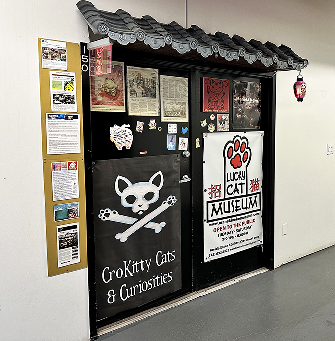 The entrance combines traditional Japanese aesthetics with playful cat imagery, setting the perfect tone for this unique cultural experience in Cincinnati.