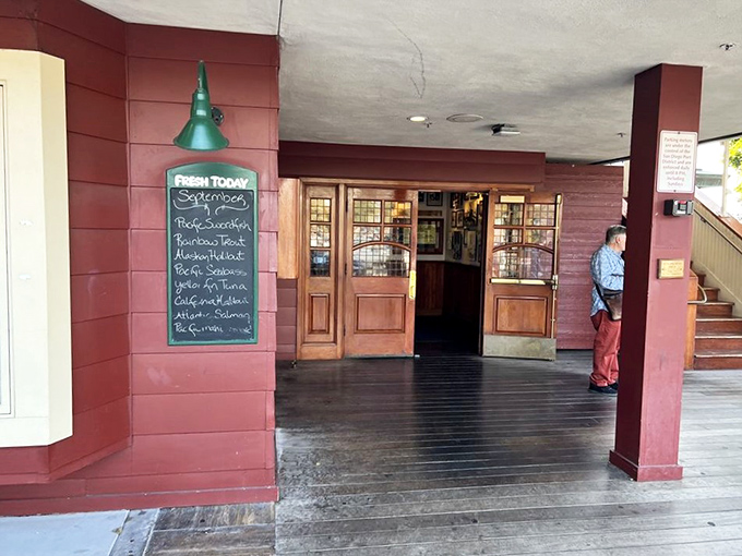 The entrance promises maritime treasures within. That chalkboard isn't just listing today's catches&mdash;it's advertising what was swimming this morning and will be dinner tonight.