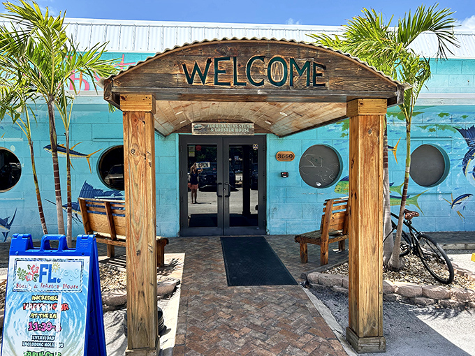 The wooden archway entrance doesn't just say "Welcome"&mdash;it practically sings it, flanked by palm trees and promising Florida Keys flavors just steps away.