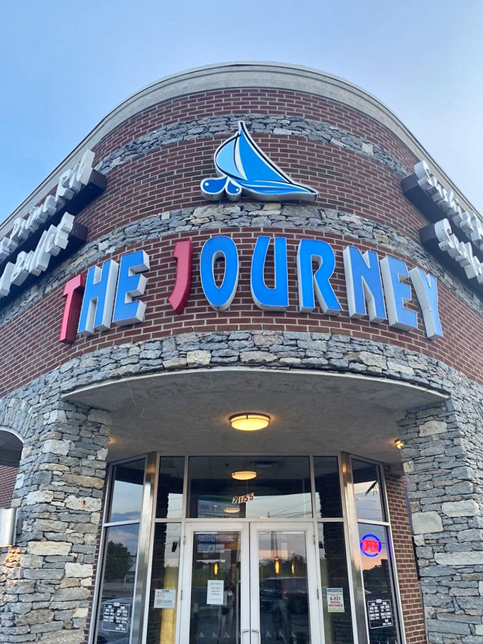 The Journey's entrance beckons with its distinctive blue and red signage. Like a lighthouse for hungry souls, it guides seafood lovers safely to shore.
