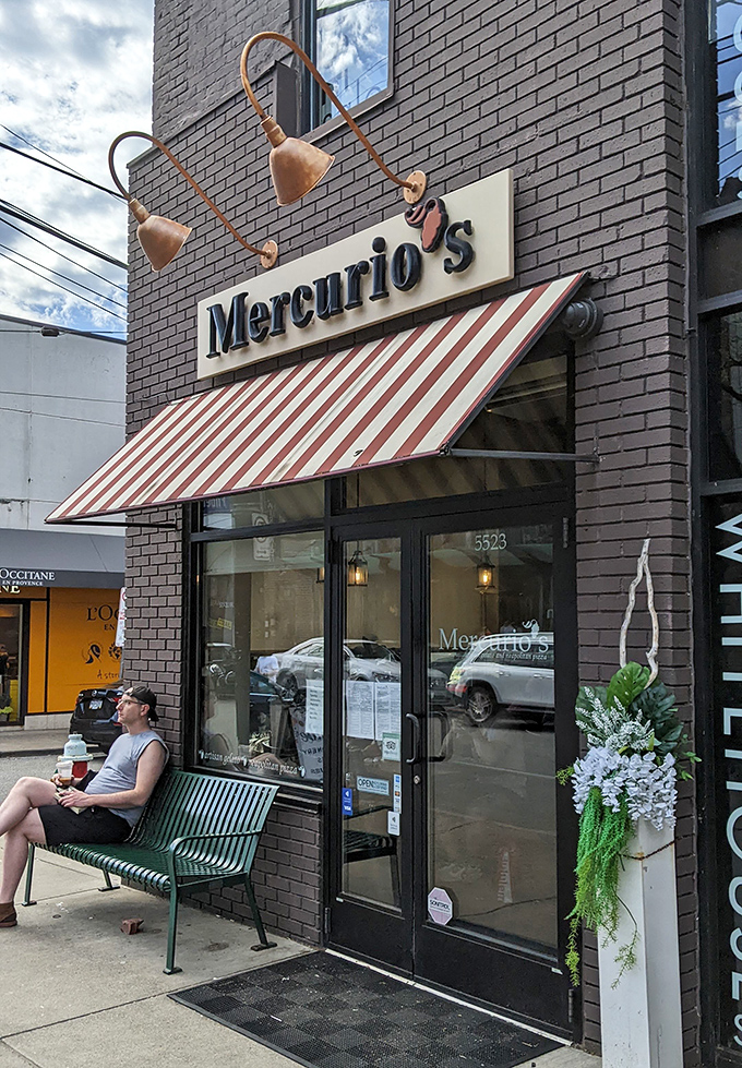 That moment when you realize you've found your new favorite spot. The bench outside Mercurio's&mdash;perfect for savoring anticipation or post-pizza contentment.