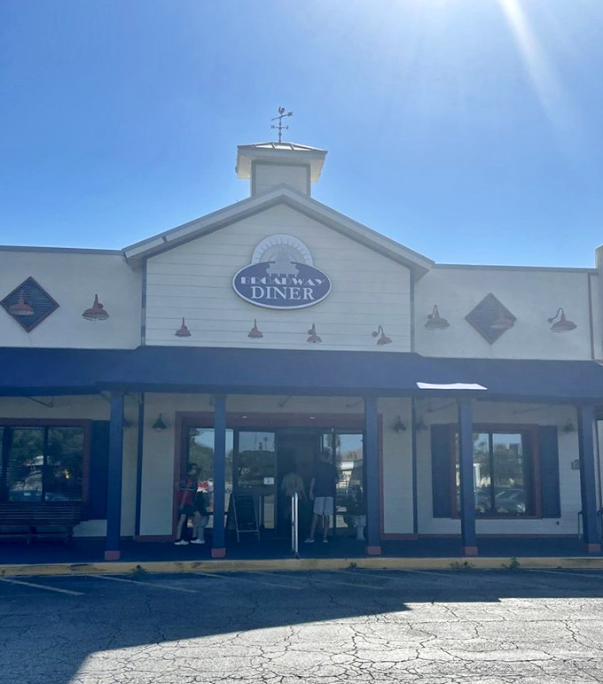 Sunshine bathes the Broadway Diner's facade, a morning beacon for breakfast pilgrims seeking biscuit and gravy salvation.