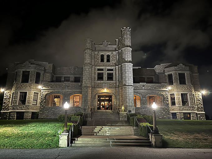 By night, Pythian Castle transforms into an ethereal vision, its illuminated limestone walls glowing against the darkness like a beacon from another time.