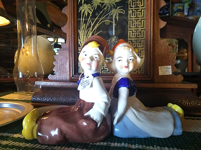 These vintage porcelain figurines are having more fun back-to-back than most couples do face-to-face. Retro charm with attitude!