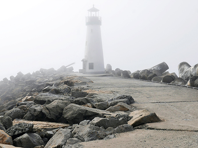 When fog embraces the lighthouse, it transforms from postcard-perfect to mysteriously moody. Like running into your accountant at a jazz club&mdash;surprisingly atmospheric.