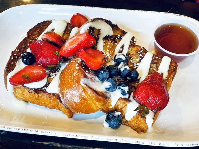 French toast that makes regular bread feel inadequate. Those berries aren't garnish&mdash;they're jewelry for a dish that deserves to be dressed up.