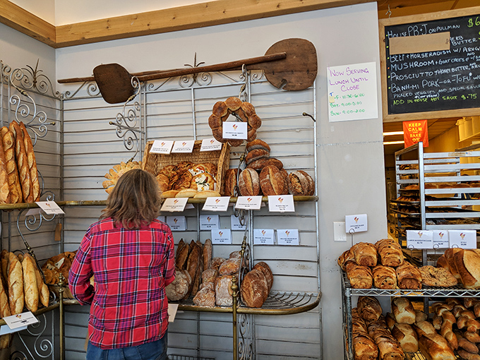 The wall of bread that launched a thousand dinner parties. Locals know that showing up with an On The Rise loaf instantly elevates your host gift game.