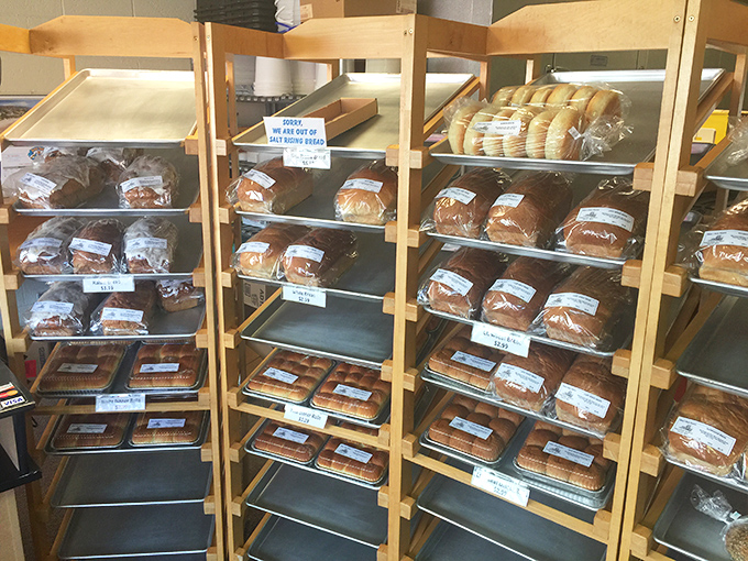Fresh bread loaves lined up like golden soldiers, each one promising the kind of flavor that grocery stores forgot.