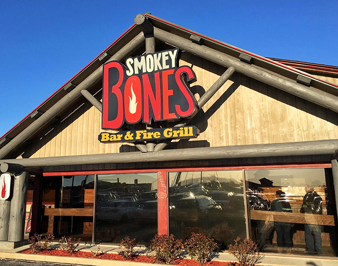 The sign glows like a barbecue beacon against the blue sky, promising smoky delights within. No filter needed when your logo is this appetizing.